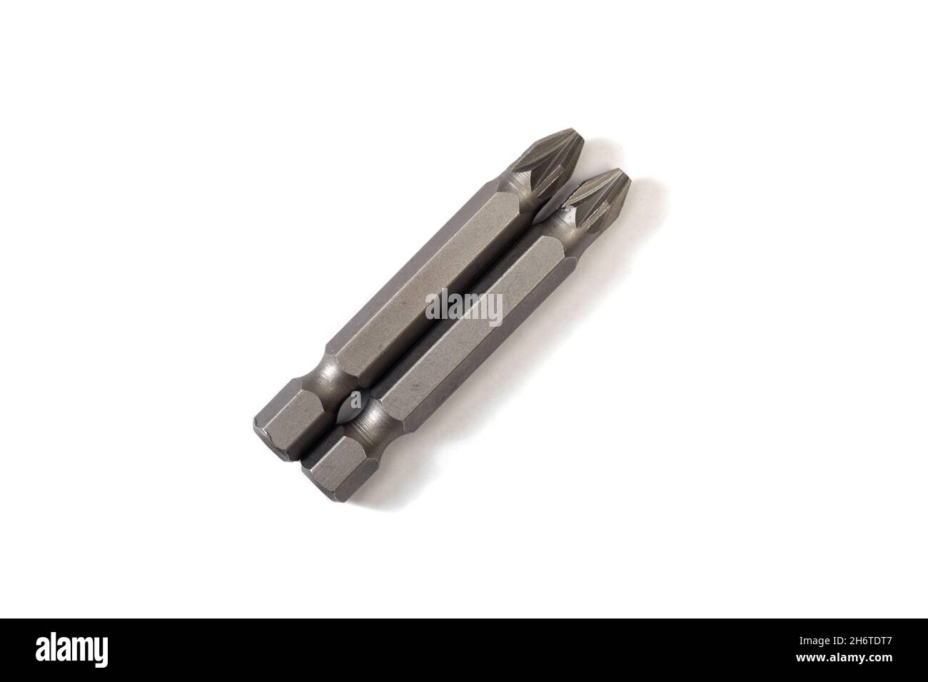 Close up of two iron screwdriver bits on white background Stock Photo - Alamy
