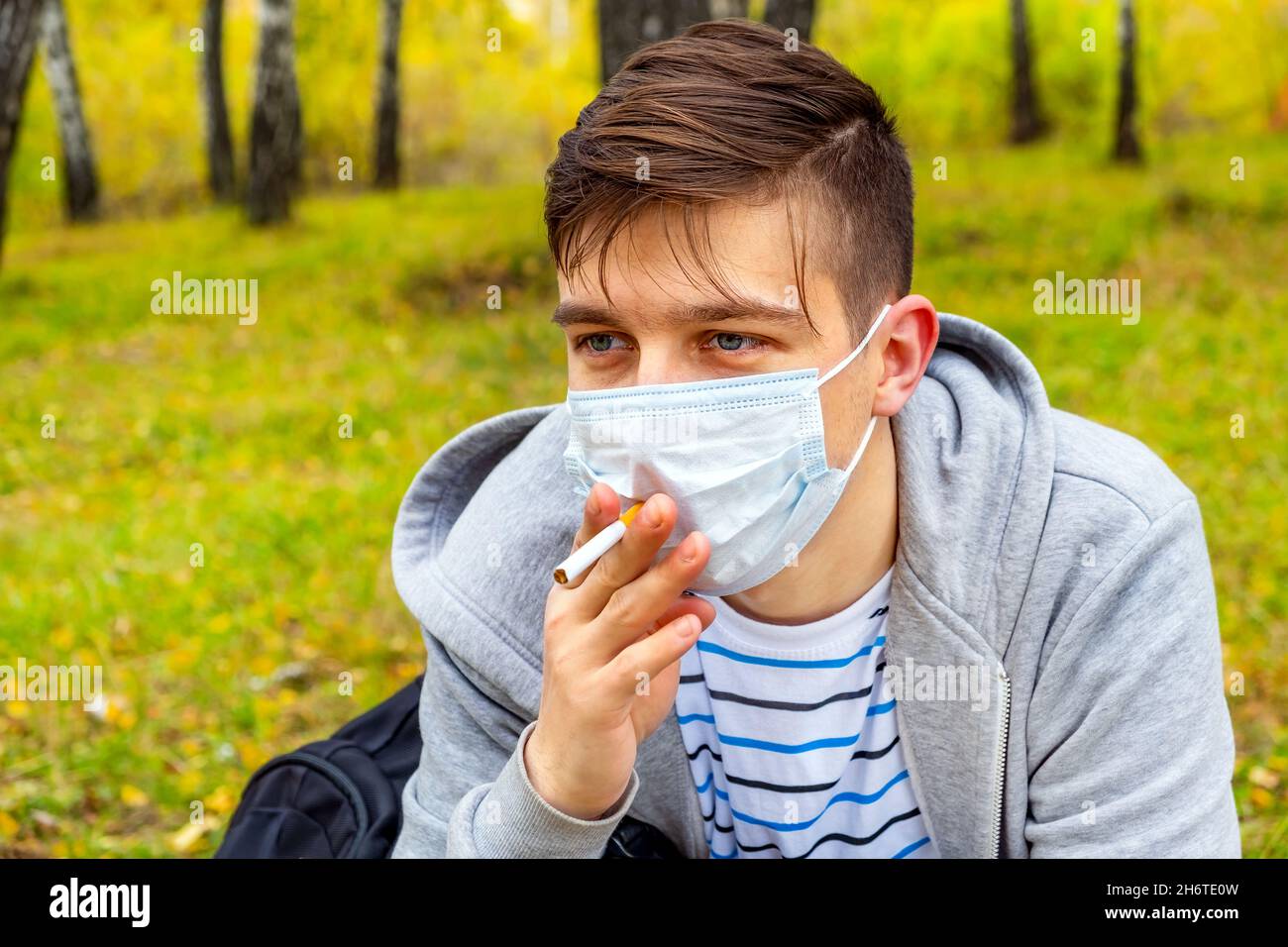 Man smoking cigarette in the forest hi-res stock photography and images ...