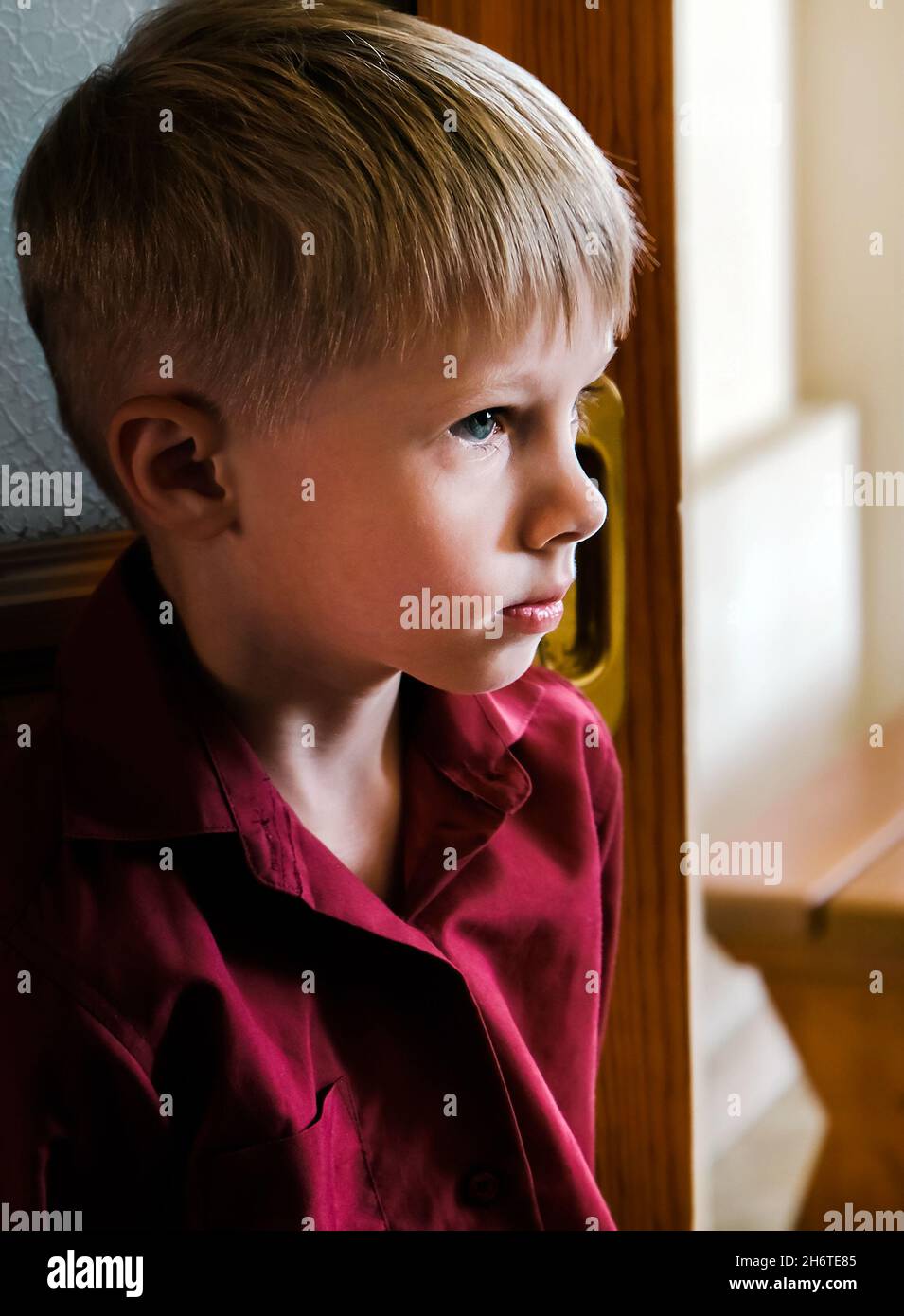 Sad Small Boy stand in the Room Portrait closeup Stock Photo - Alamy