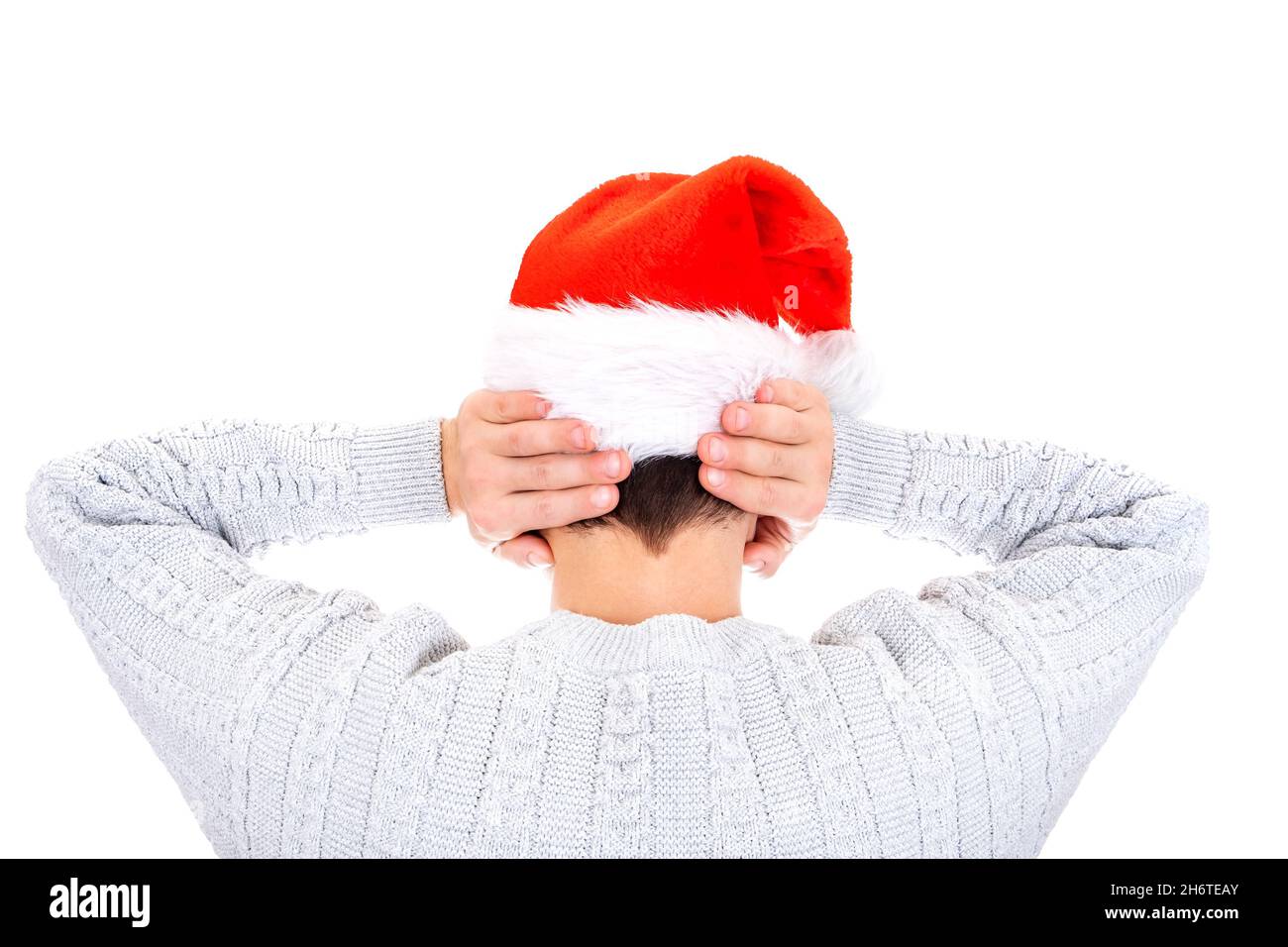 Rear View of Man in Santa Hat Covering his Ears on the White Background ...
