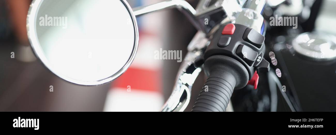 Motorcycle mirror with throttle handle on handlebars closeup Stock ...