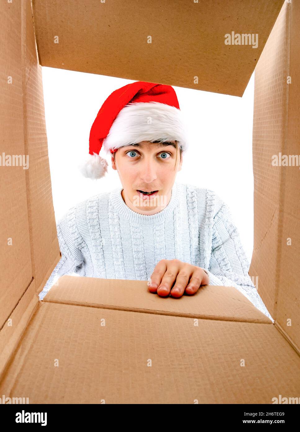 Surprised man looking open gift box hi-res stock photography and images ...