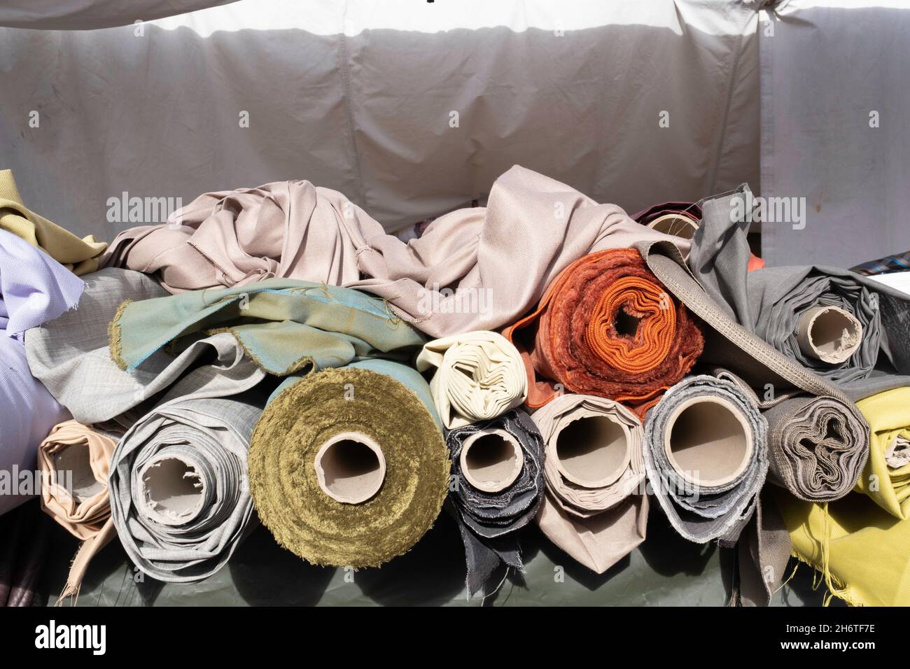 Rolls of textile fabric in all kinds of colors that are offered for ...