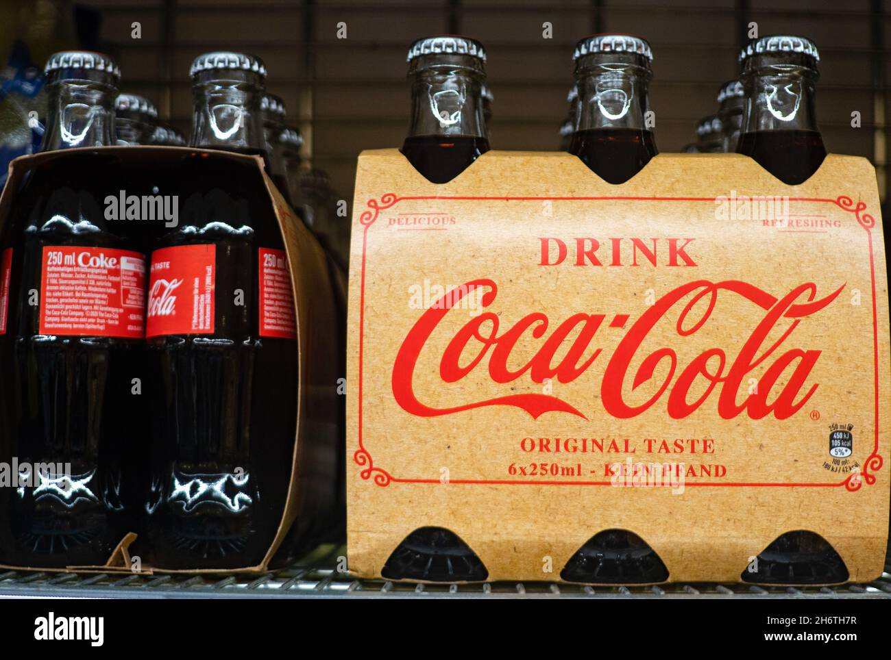 Coca-Cola glass bottle packs seen on shelves at a store. (Photo by Igor ...
