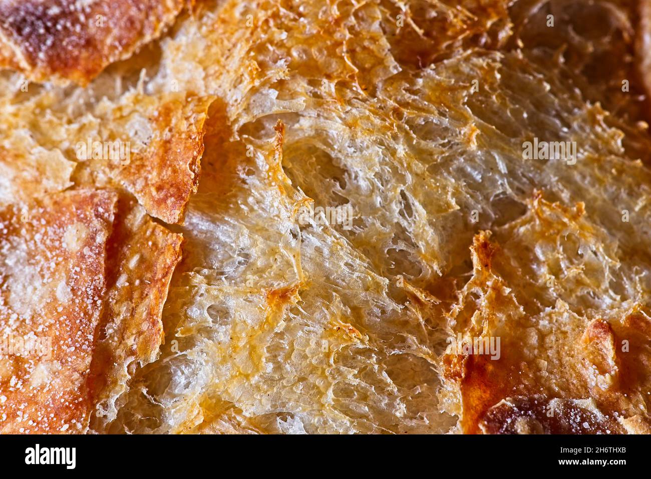 Macro detail of top of home made craft bread with nice crispy textured ...