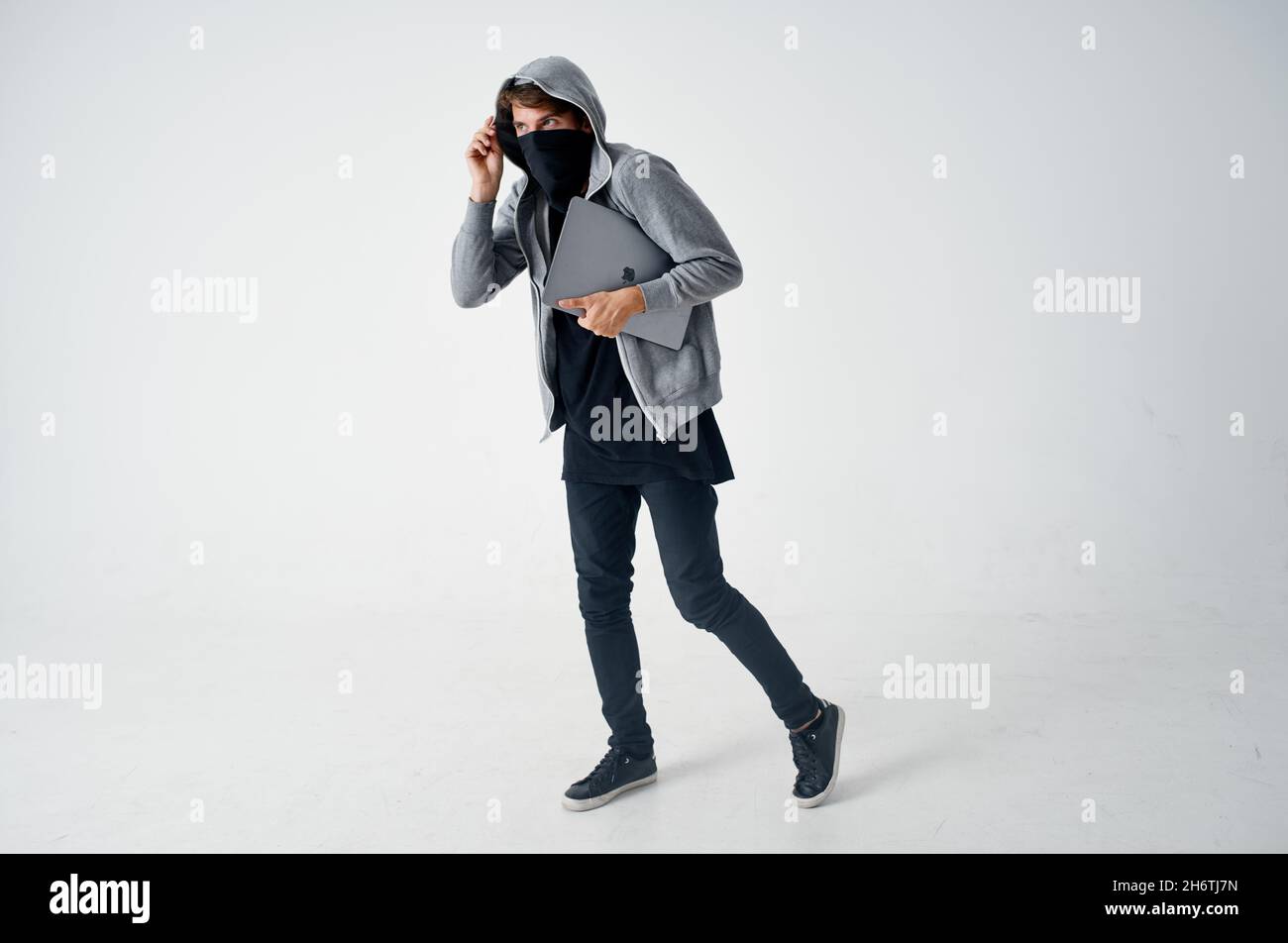 masked man hooded head hacking technology security Lifestyle Stock Photo - Alamy