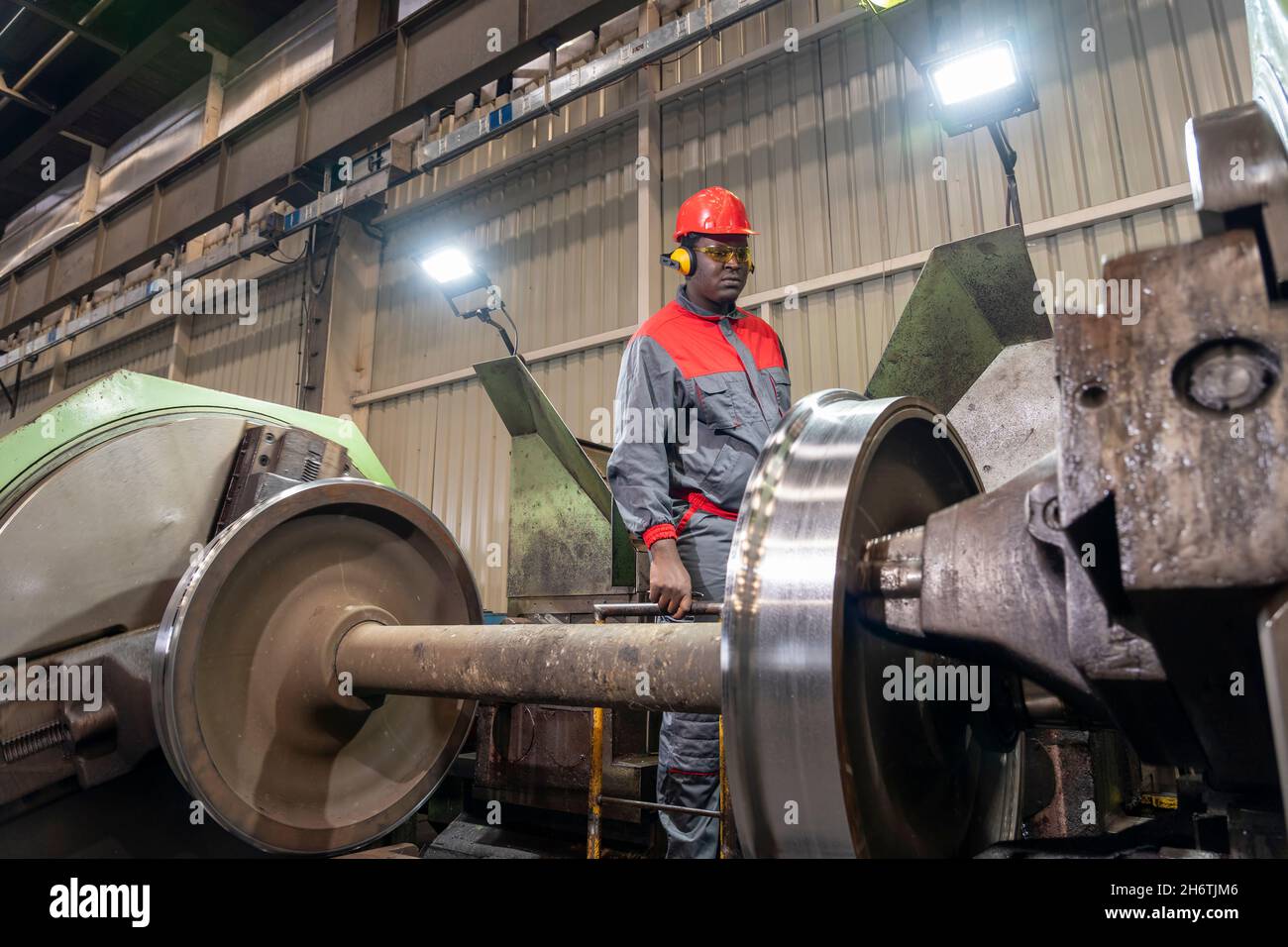 Portrait Of African American Industrial Worker In Red Helmet, Yellow ...