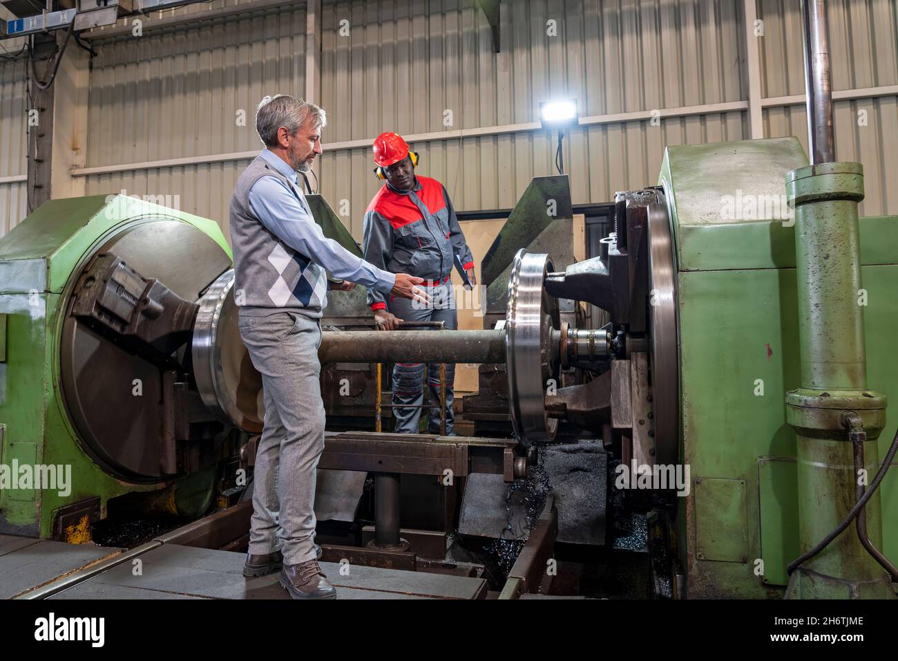 Production Manager Giving Orders To African American CNC Machine ...