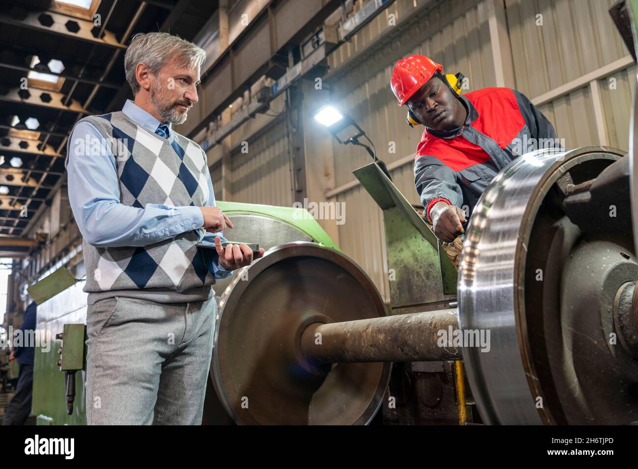 Multiracial Industrial Co-Workers Standing Next To Lathe Machine ...