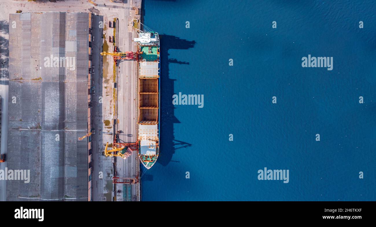 Cargo ship loading trading port to pier. Concept of paralyzed marine ...