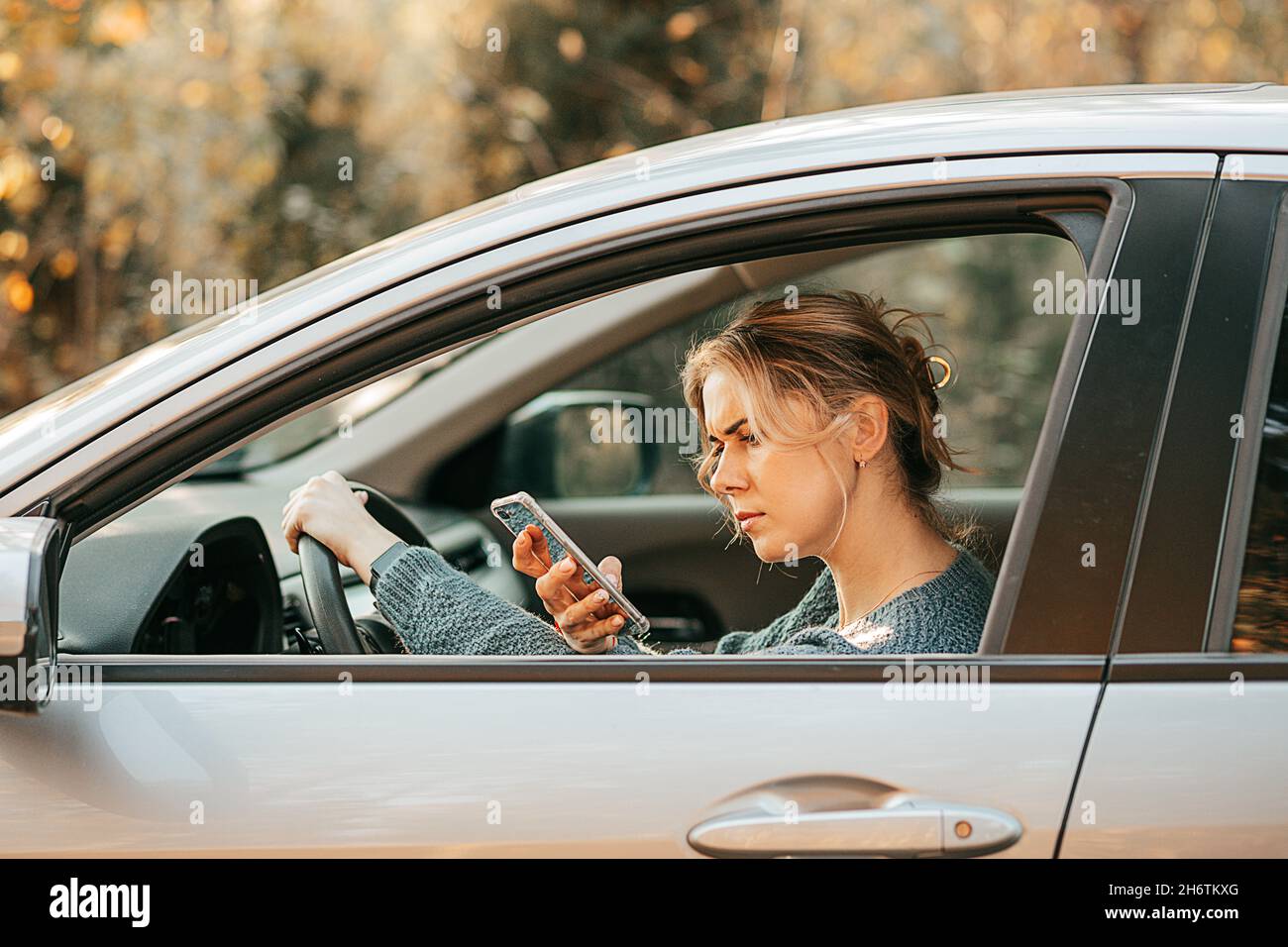 Photo of Young beautiful woman drives car, violates traffic rules, gets ...