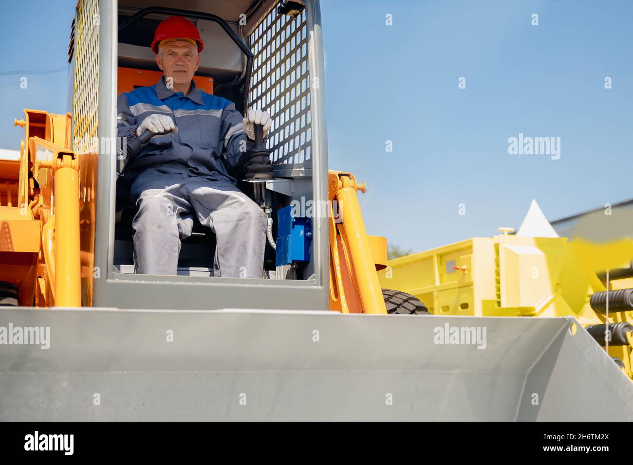 Man driver in operator cab hi-res stock photography and images - Alamy