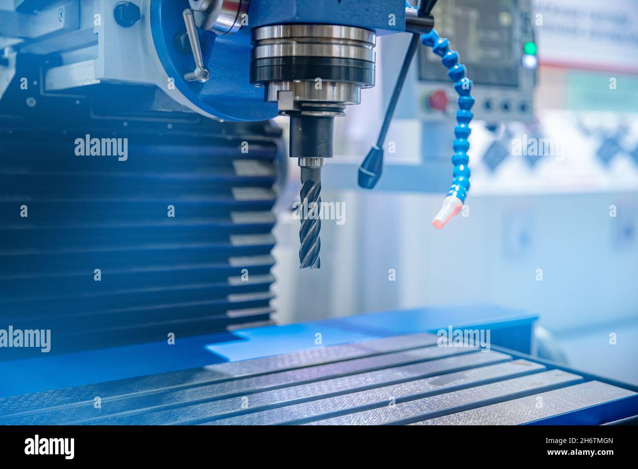 Closeup Modern Drilling CNC machine on metal in automatic production ...