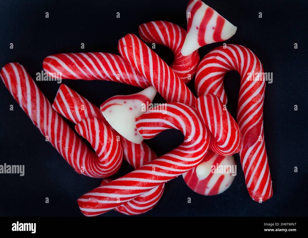 small candy canes and red and white sweets with copy space Stock Photo ...