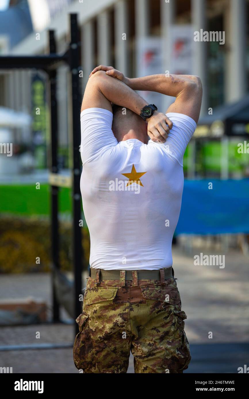 Military Soldier Stretching with Upper Limbs Stock Photo - Alamy