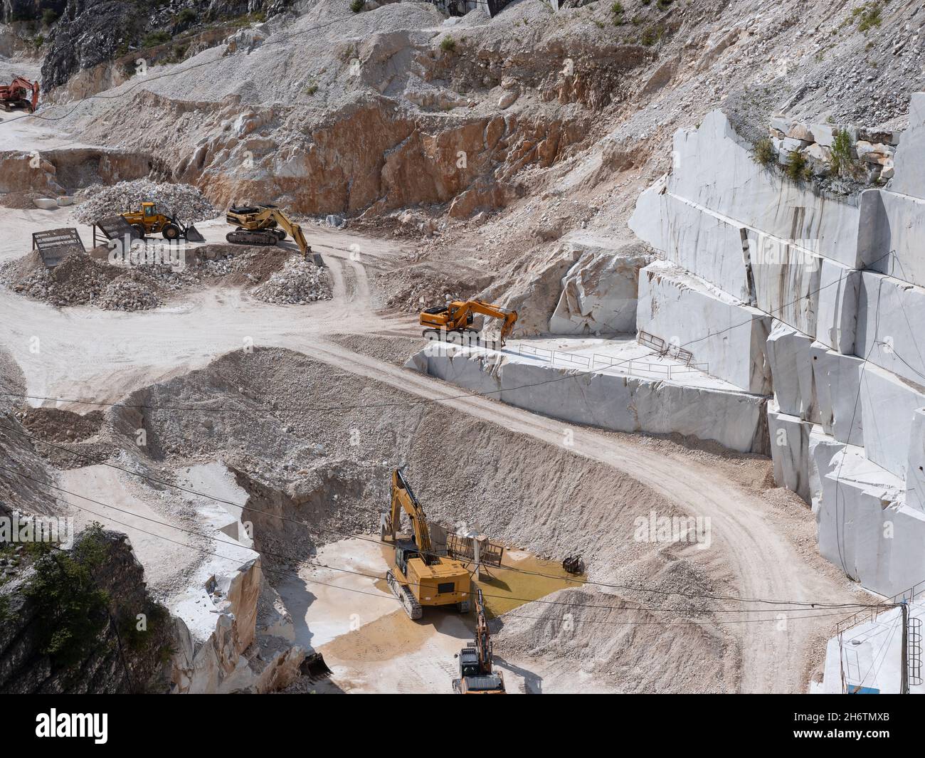 View of the Carrara Marble Quarries with Excavation Vehicles ready for ...