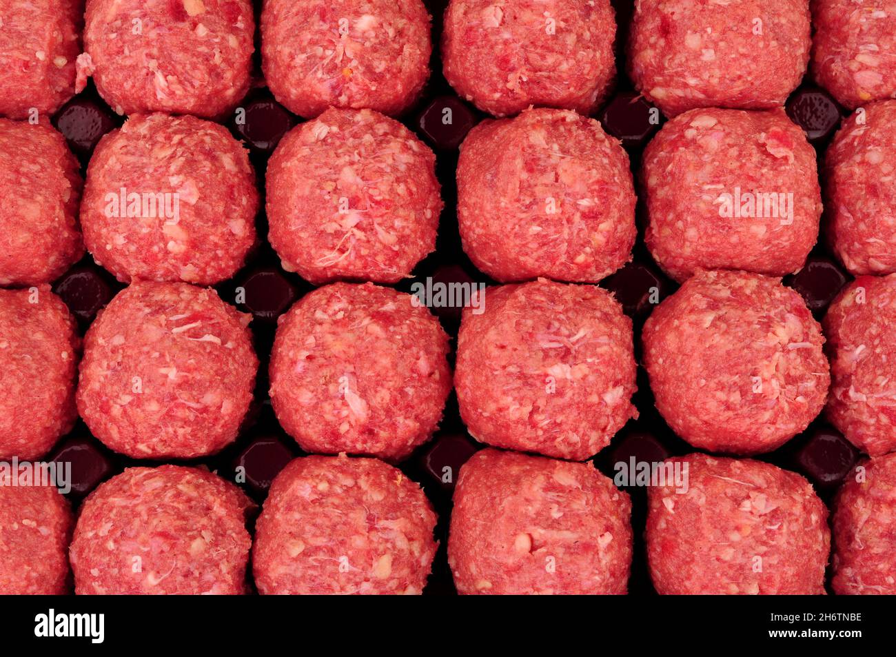 Fresh raw ground beef meat meatball pack background Stock Photo - Alamy