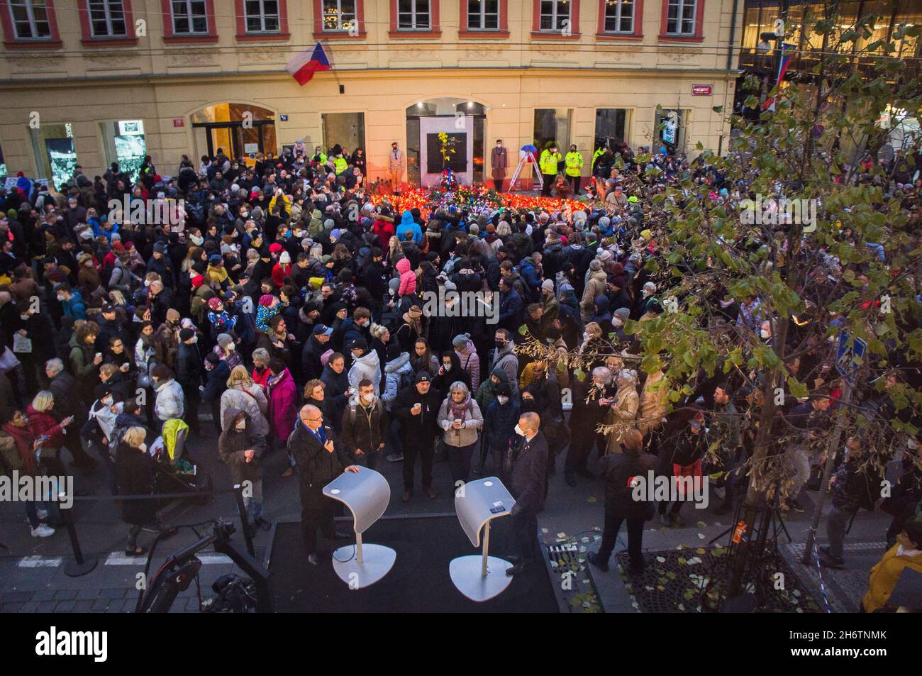 People light candles below the memorial plaque marking the November ...