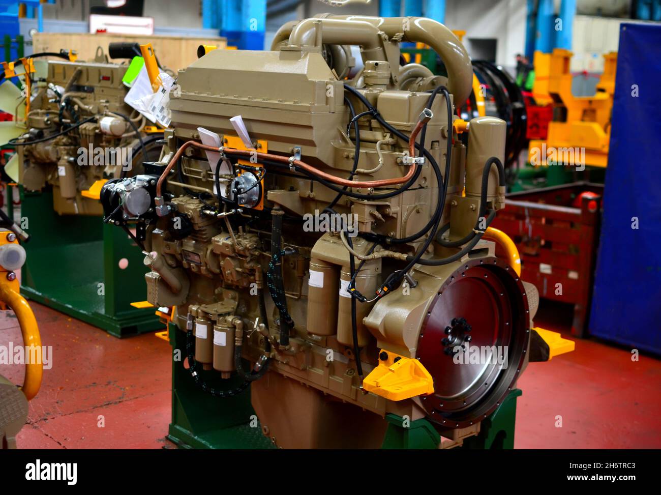 Diesel engines with huge turbines on assembly line in the workshop of ...