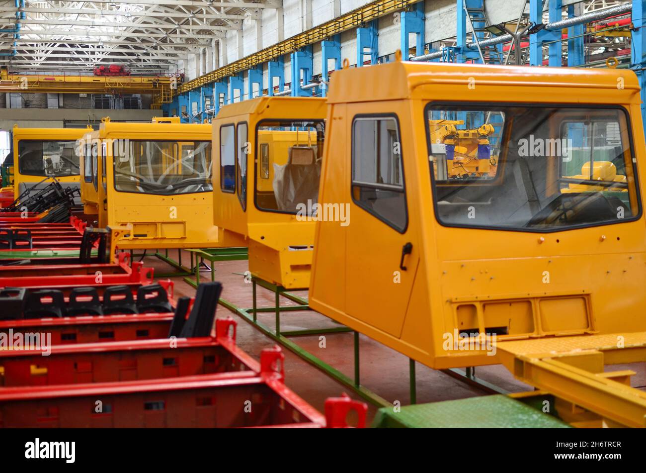 Production process of heavy mining trucks at the factory. Dump truck on ...