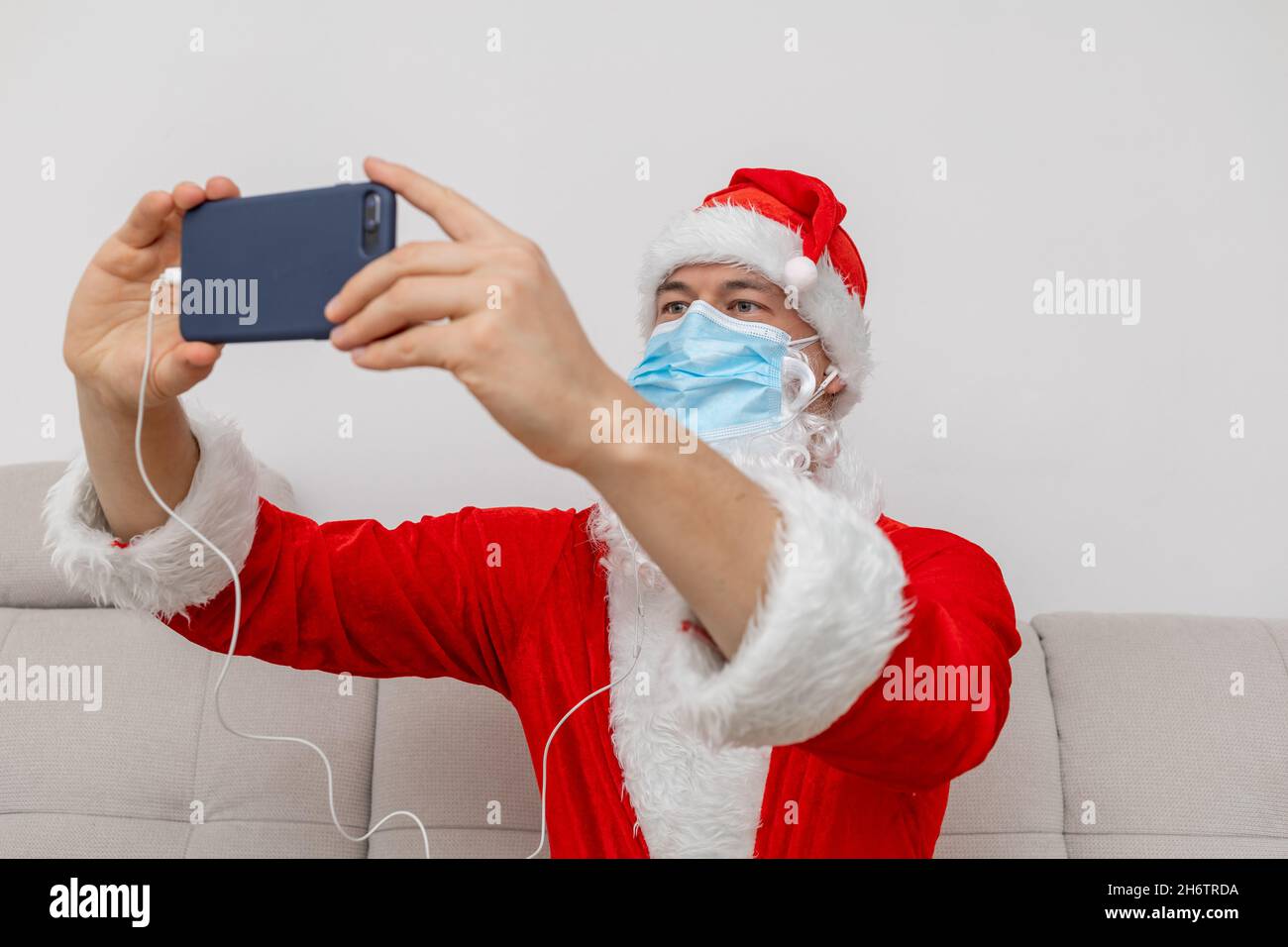 dressed as Santa Claus talking via video conference Stock Photo - Alamy