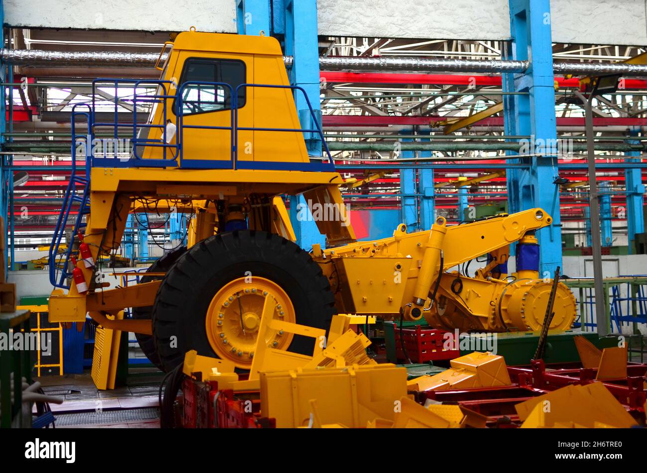 Production process of heavy mining trucks at the factory. Dump truck on ...