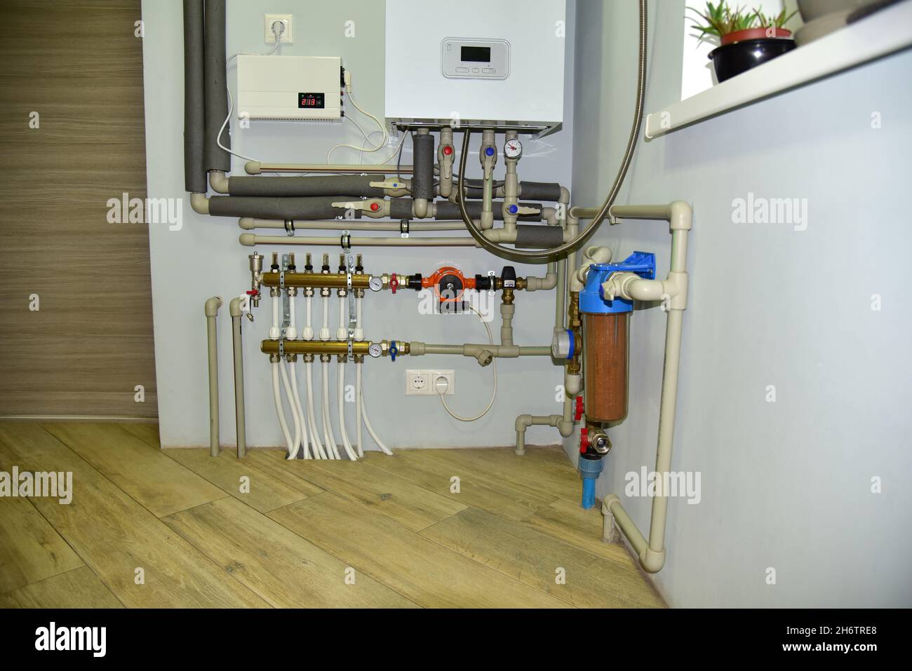 Modern independent heating system in boiler room. Household water ...