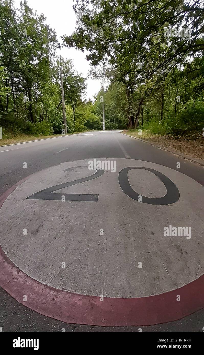 The park has a wide asphalt road with a 20 km speed limit painted on it ...