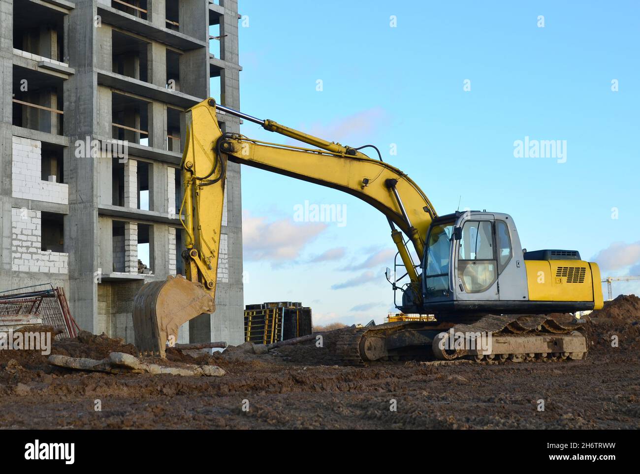Excavator broken down at construction site. Broken track at the ...