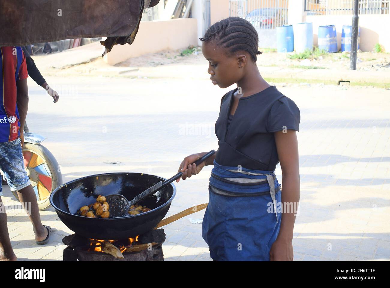 A Young African girl frying beans cake(akara Stock Photo - Alamy