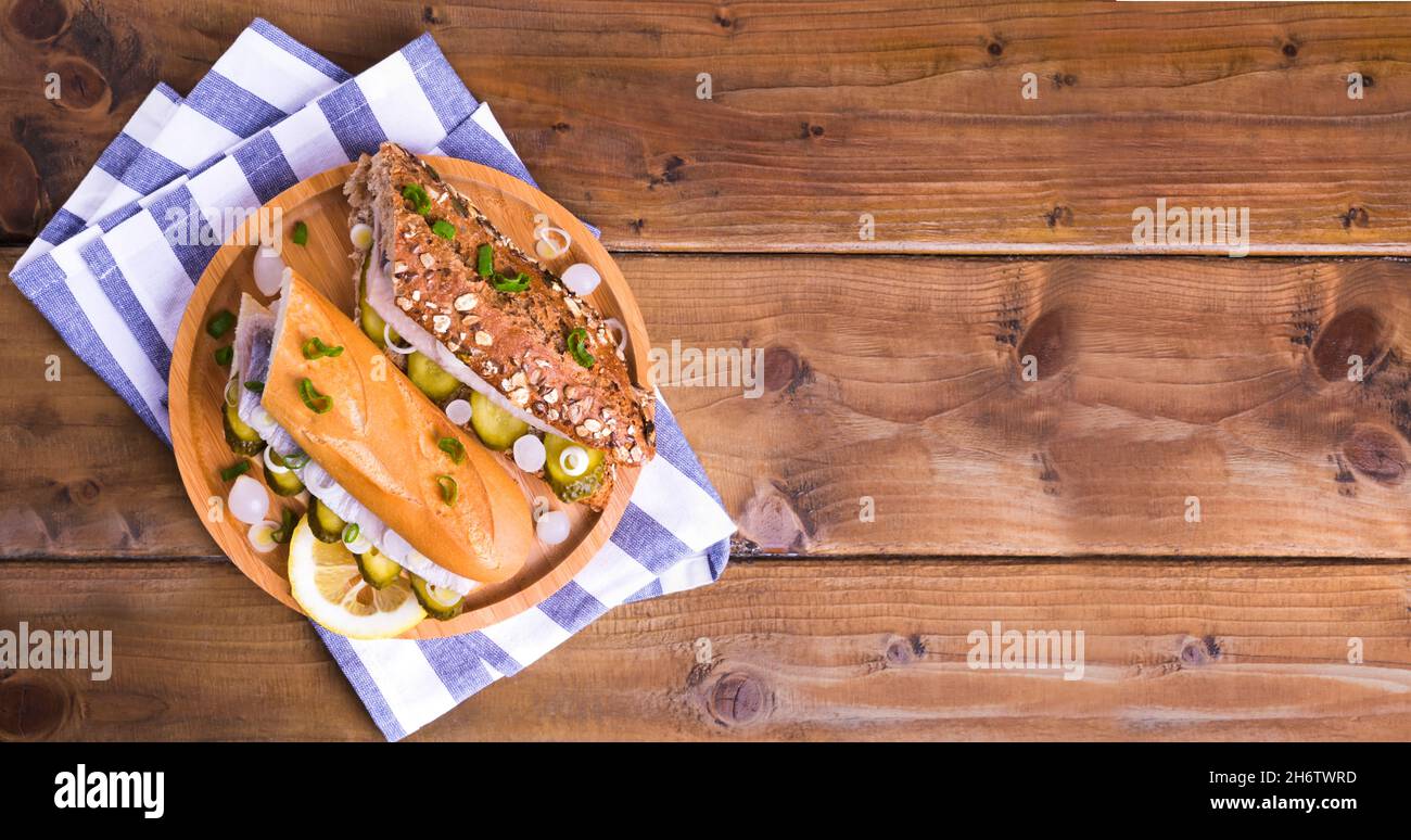 Dutch herring. Toast with Dutch herring, onions, pickles. Traditional ...