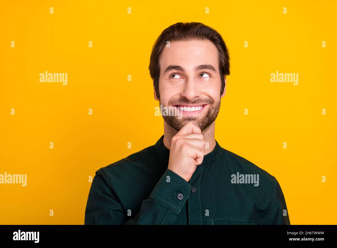 Photo of impressed millennial guy hand face look promo wear green shirt ...