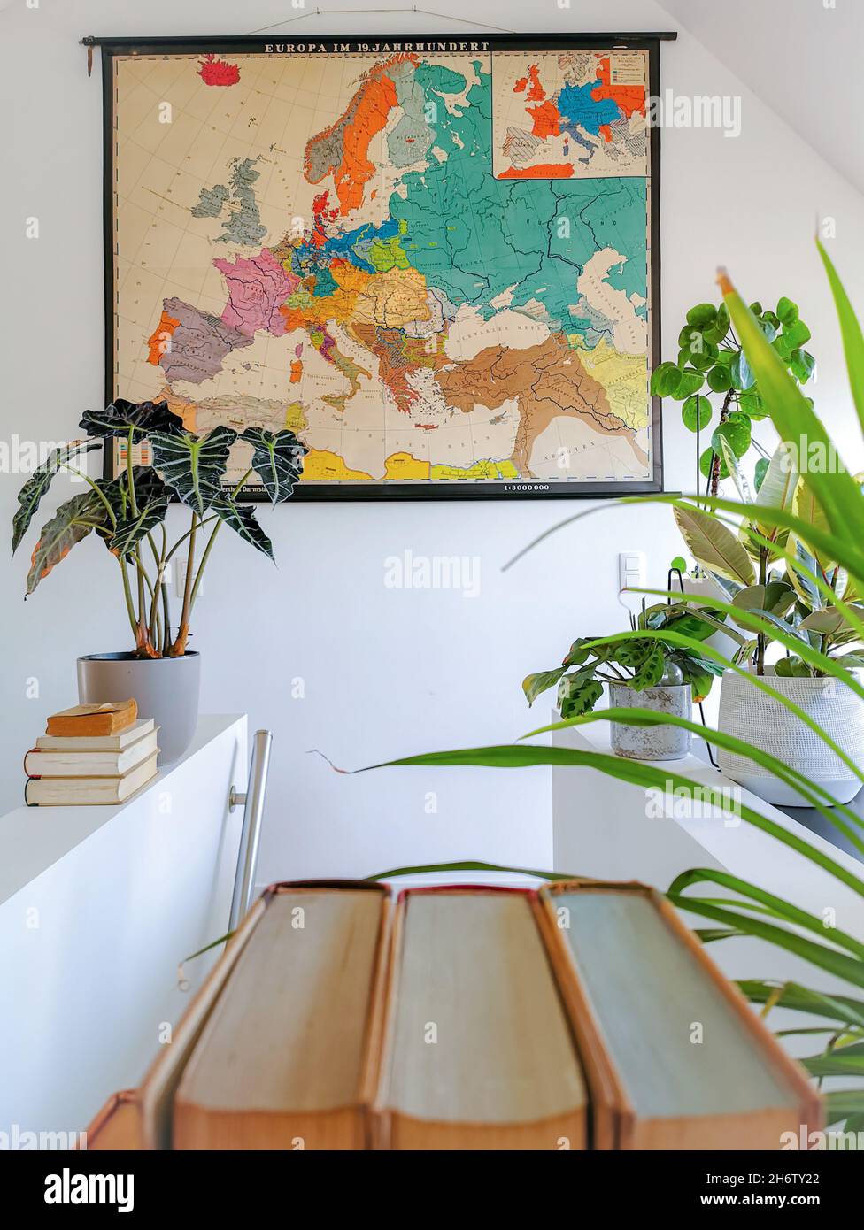 Retro library interior with old books, vintage poster and multiple ...