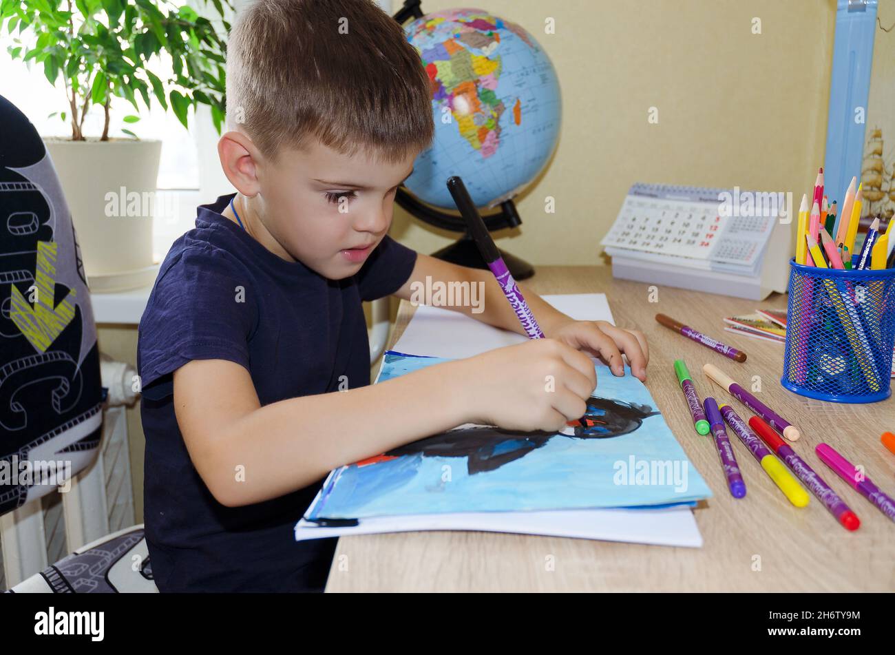 Back to school. Little tired boy doing homework at home with backpack ...