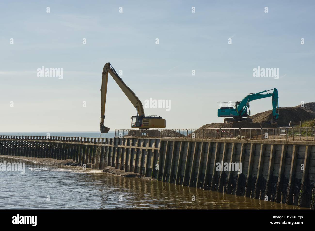 Mechanical excavators dredging the River Arun at Littlehampton, West ...