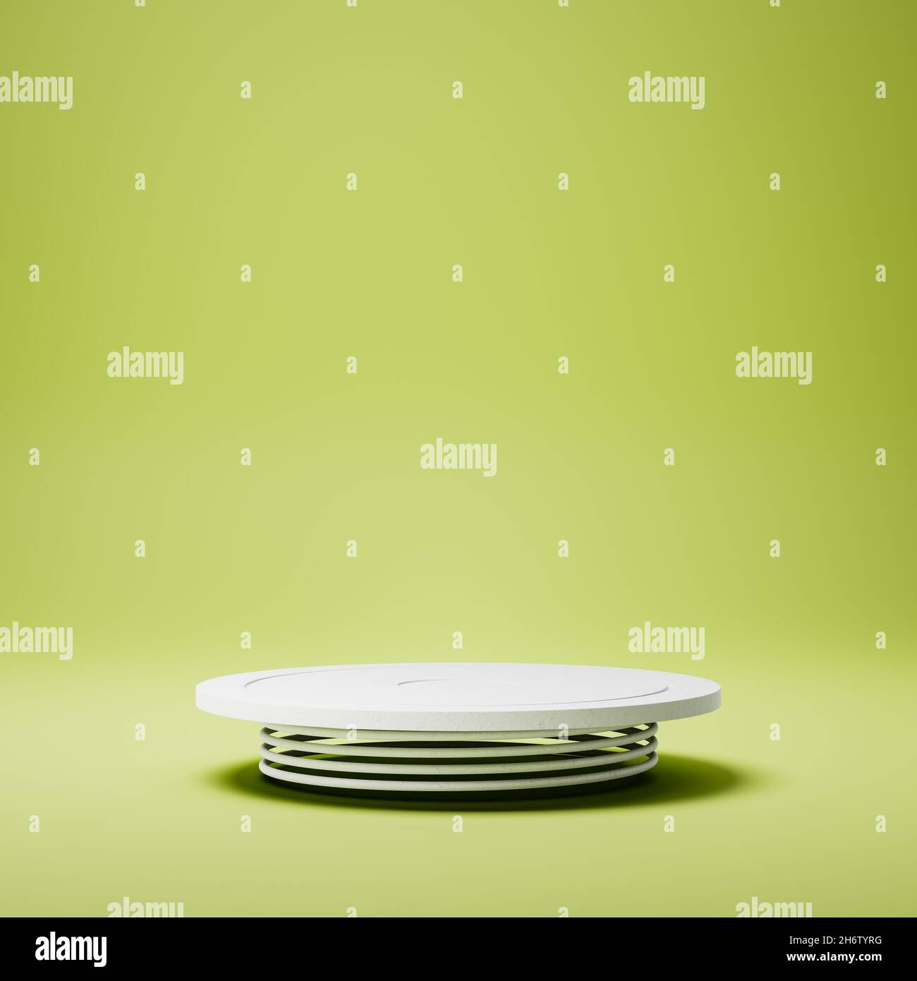 White Rounded Product Display Pedestal with Spring on Green Background ...