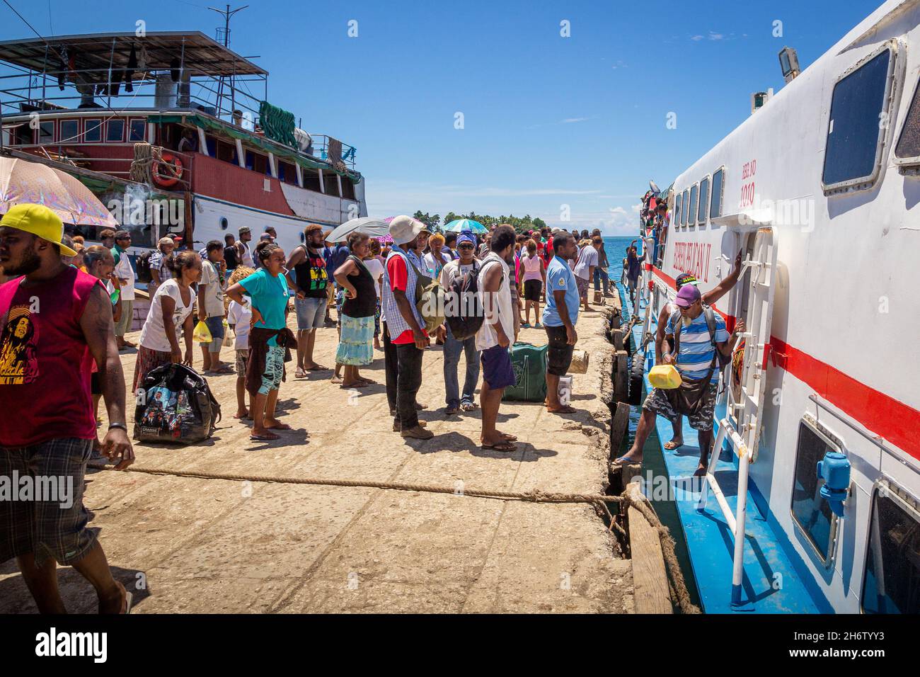 AUKI, SOLOMON ISLANDS - Dec 09, 2016: A crowd of people on Auki Wharf ...