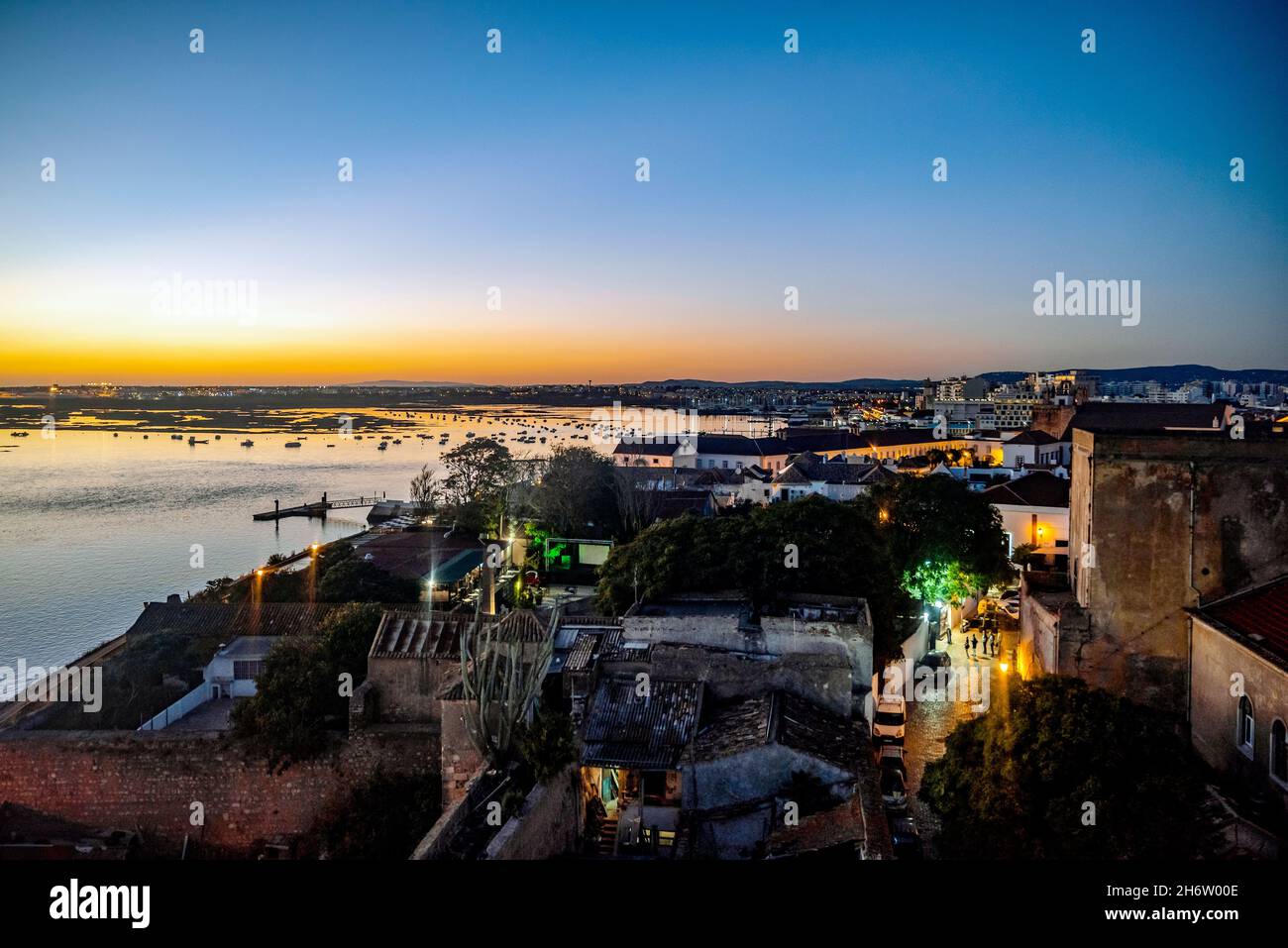 Faro cityscape by sunset - historic architecture and Ria Formosa ...