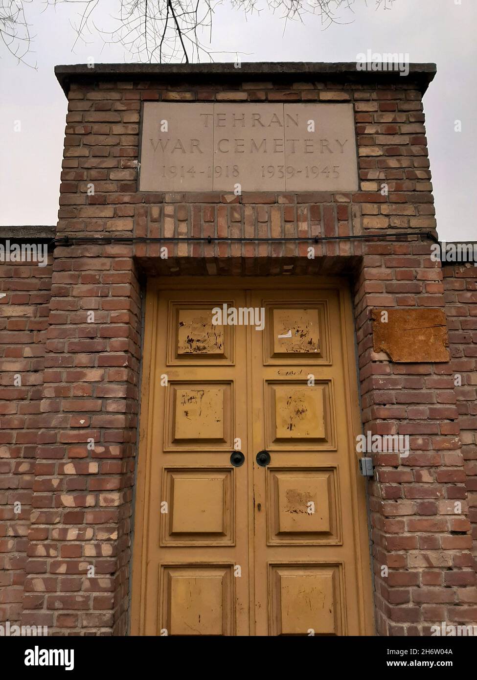 Low-angle shot of the facade and wooden door of Commonwealth War ...