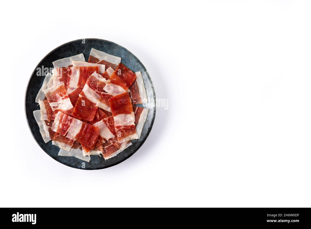 Spanish serrano ham isolated on white background Stock Photo - Alamy