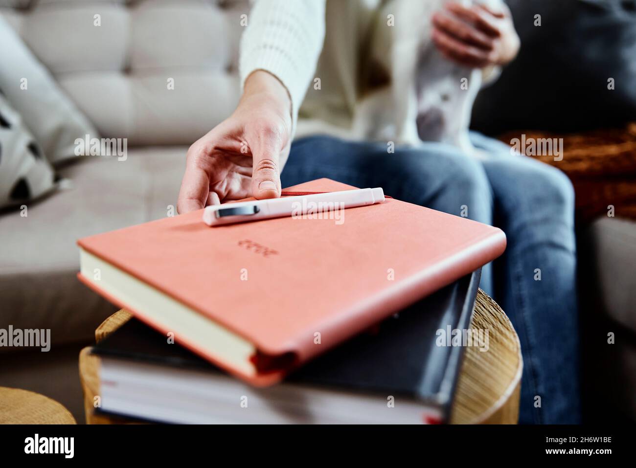 Female hand take notebook form table. Woman works at home Stock Photo ...