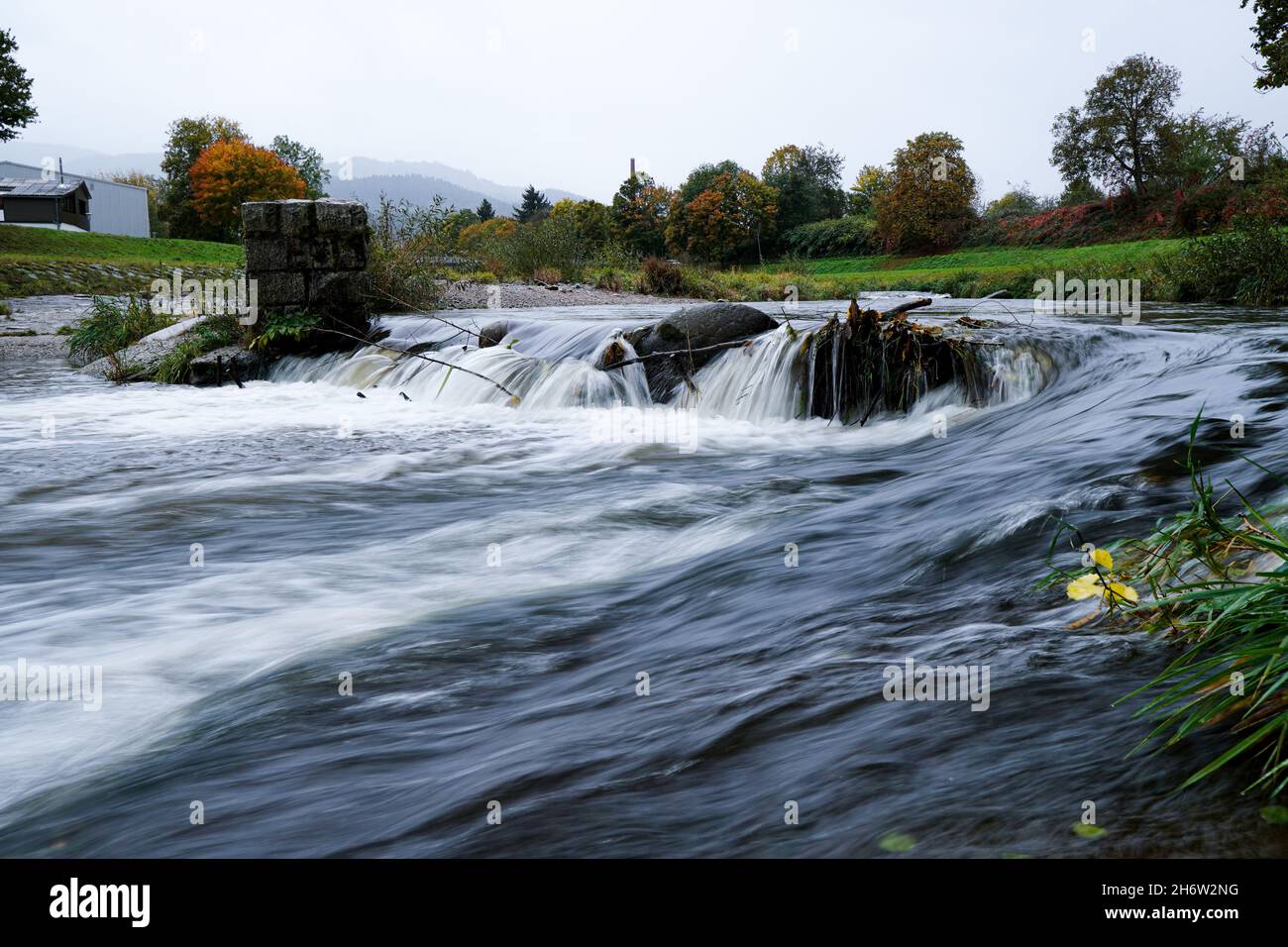 Powerful river rapids with trees in the background during fall Stock ...