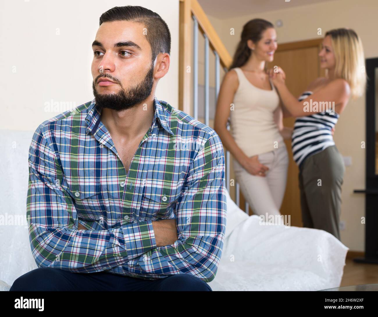 person keeping silence turned away from friends Stock Photo - Alamy