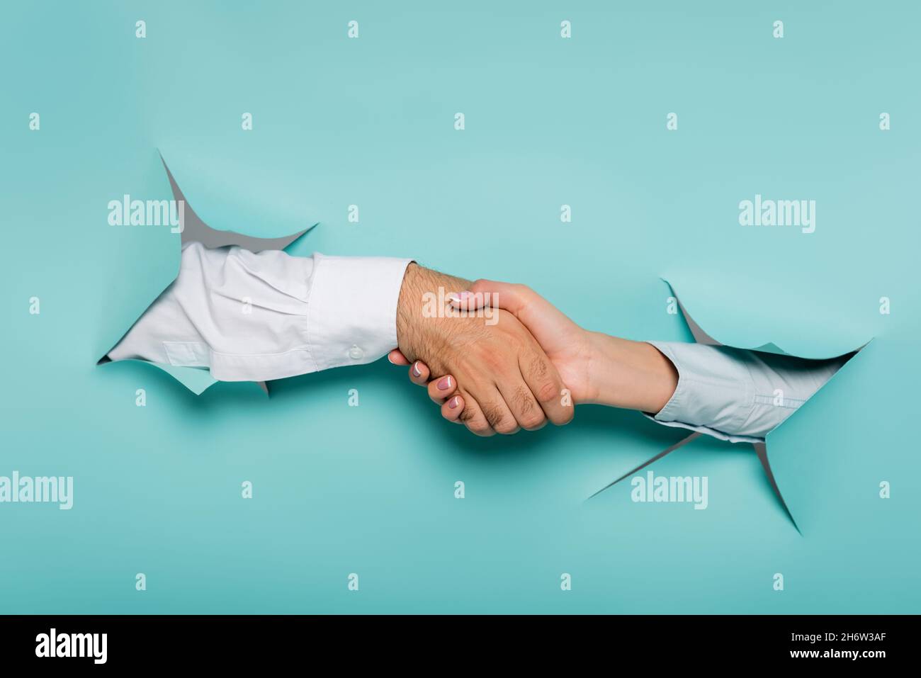 Shaking hands on wall hi-res stock photography and images - Alamy