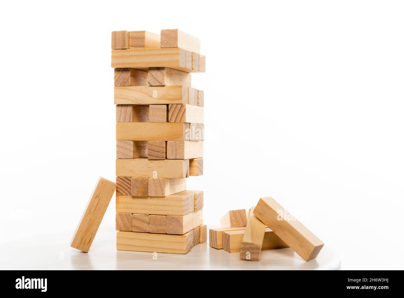 blocks wood tower game on white background Stock Photo - Alamy