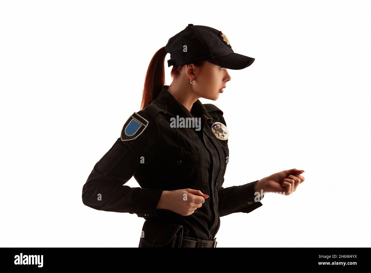 Close-up shot of a redheaded female police officer posing for the ...