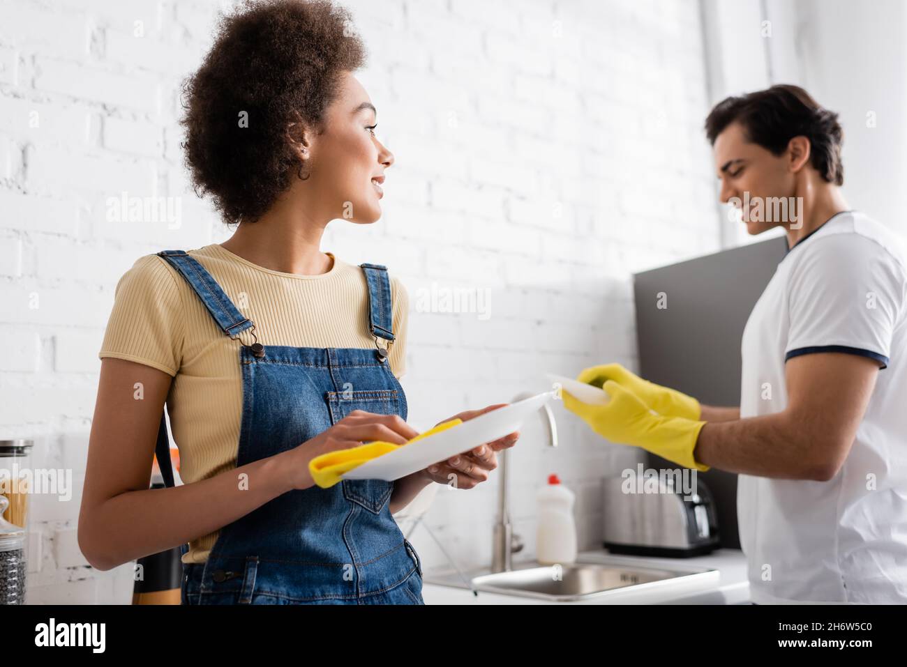 African woman washing dishes smiling hi-res stock photography and ...