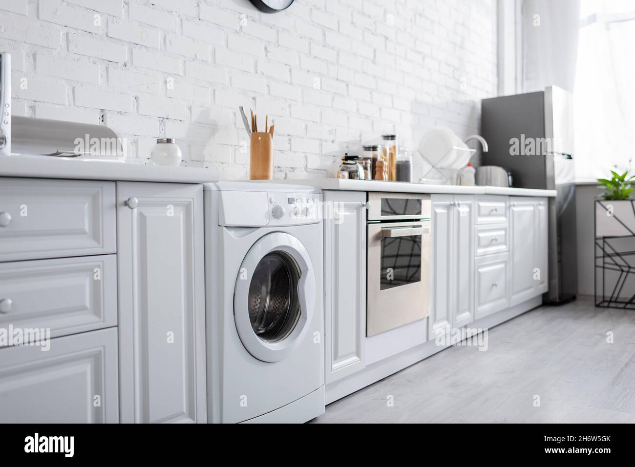 modern kitchen with white household devices Stock Photo - Alamy
