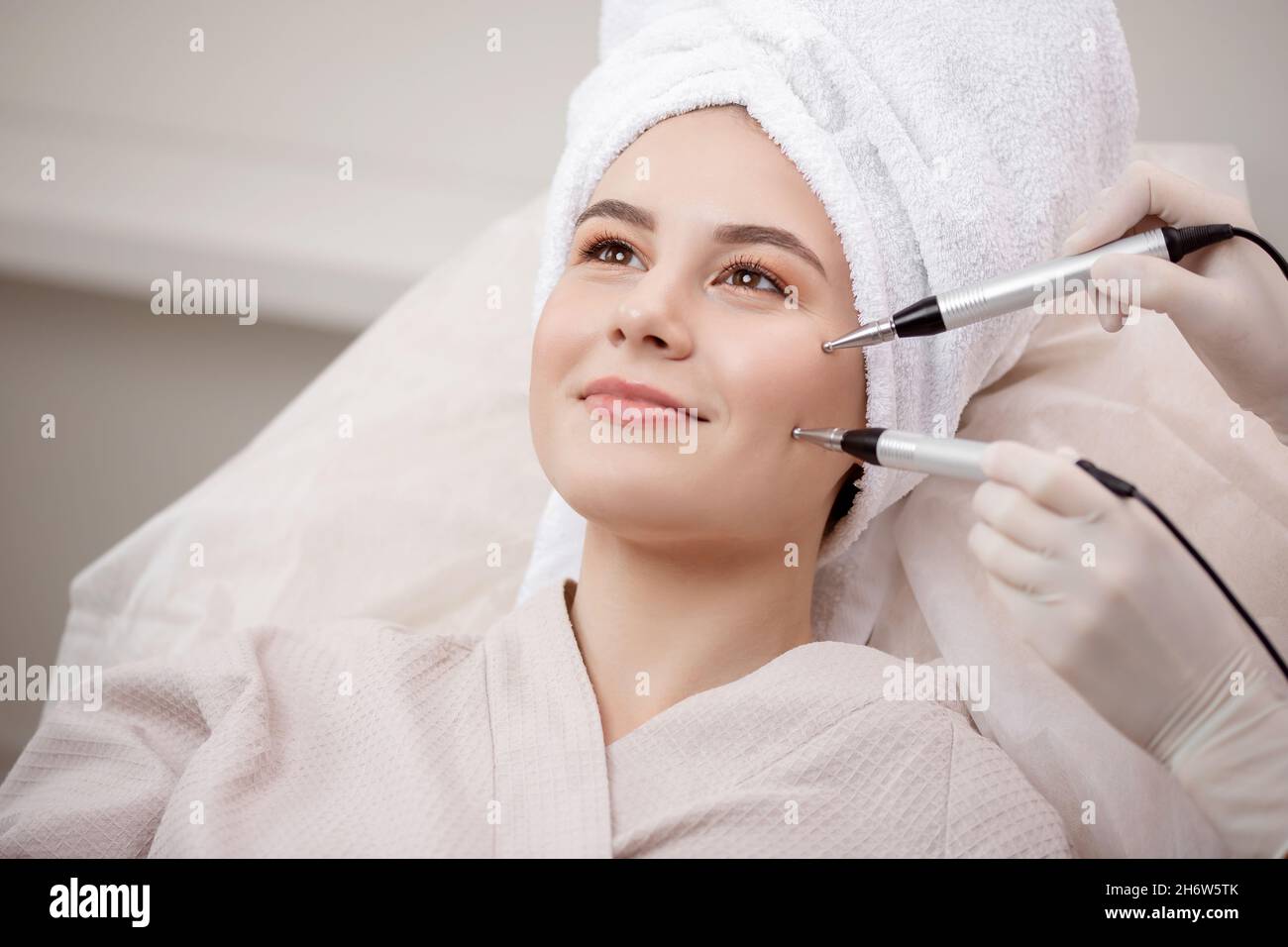 Therapy Microcurrent procedure spa vs acne. Beautiful woman receiving ...