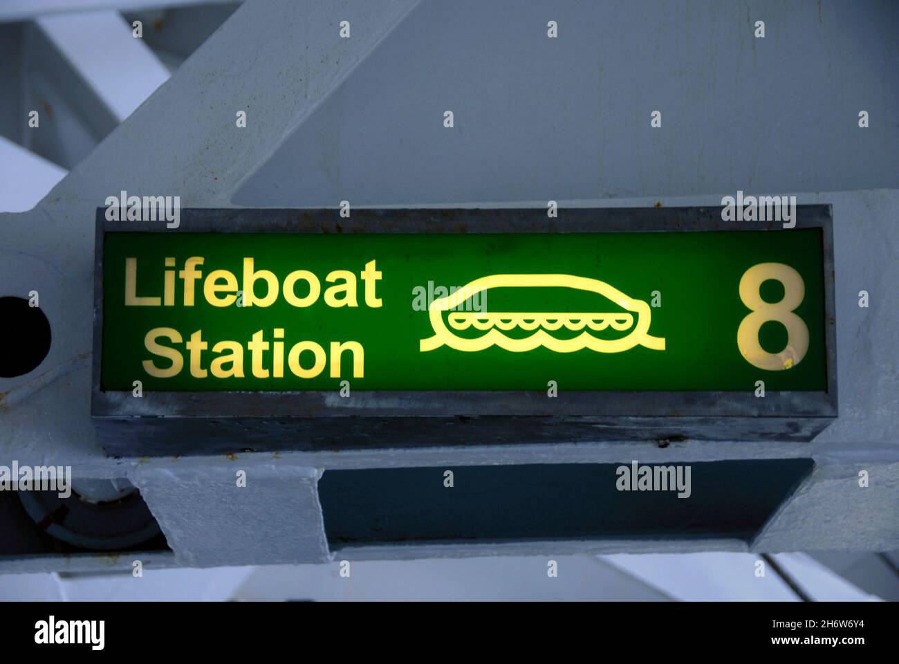 Illuminated sign on cruise ship indicating location of lifeboat station ...
